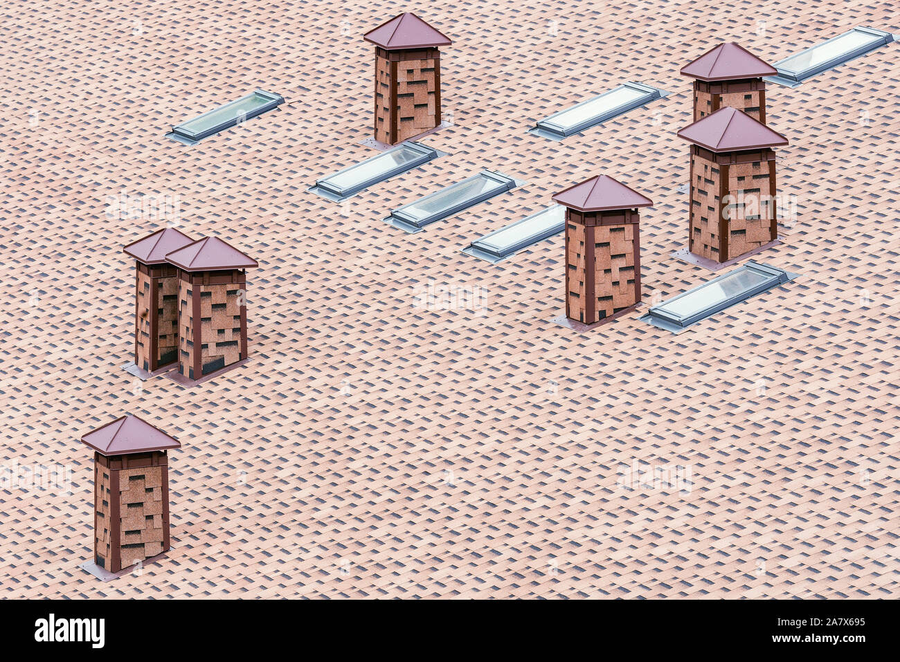 Many chimneys and windows on the house roof Stock Photo - Alamy