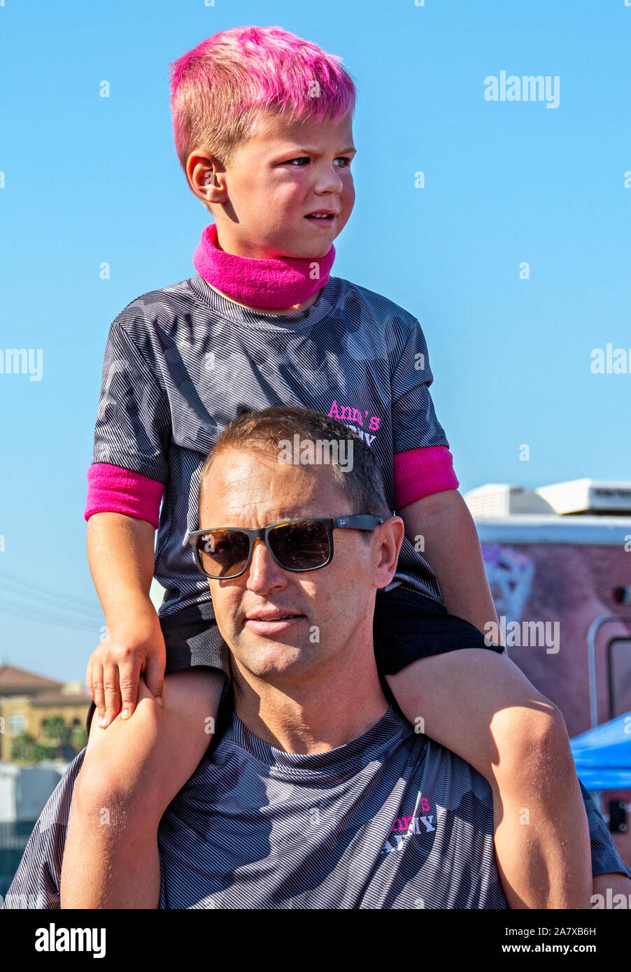 Boy sitting on shoulders hi-res stock photography and images - Alamy