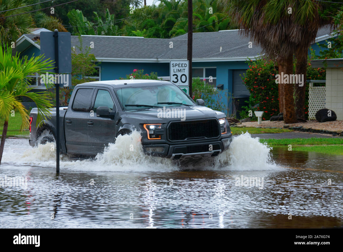Heavy flooding and storm surge in residential neighborhood with a big ...