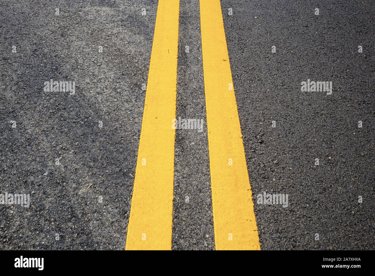 Yellow of traffic lines on the road with background Stock Photo - Alamy
