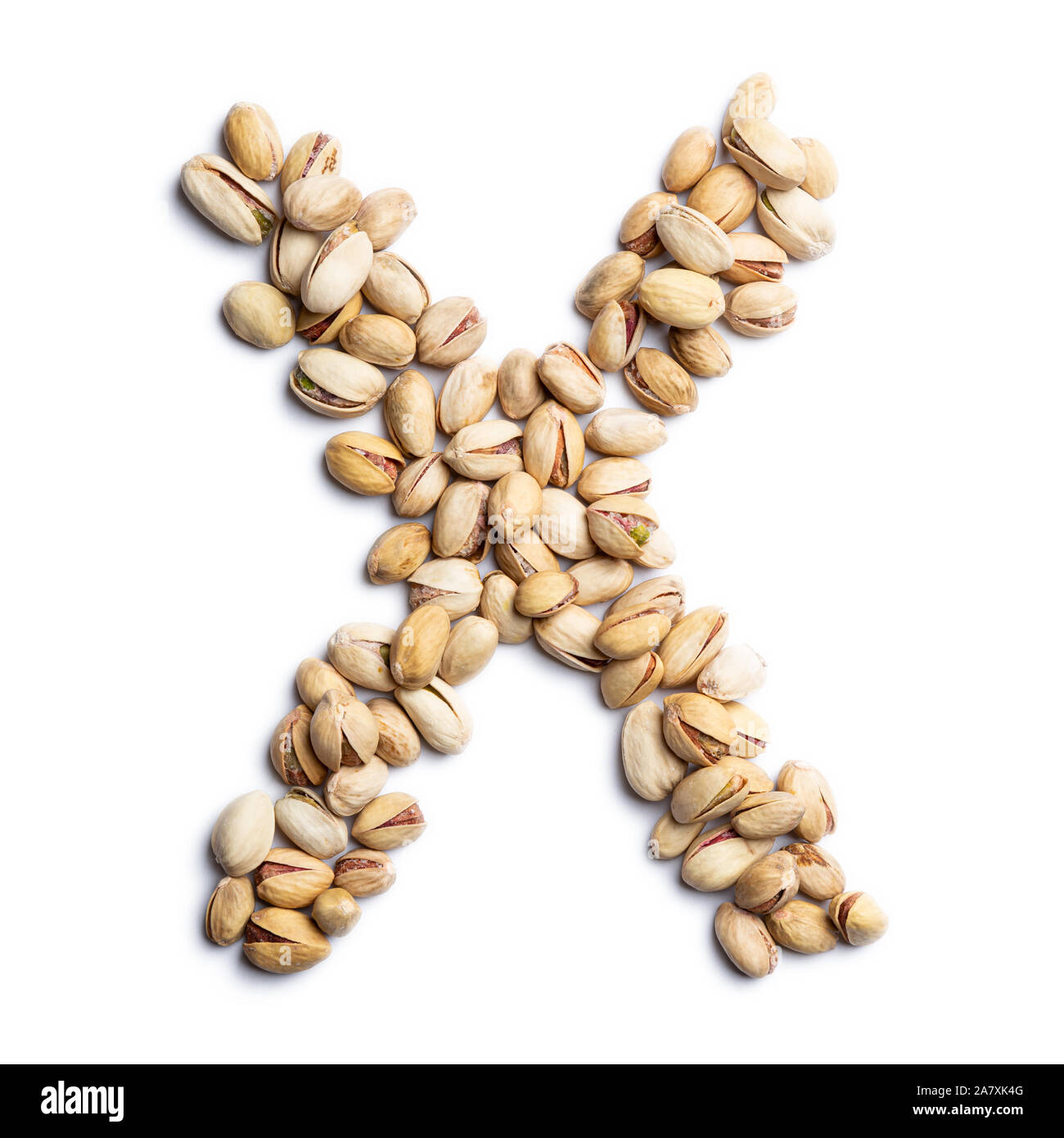 The letter "X" of the English alphabet from a unpeeled pistachios on a ...