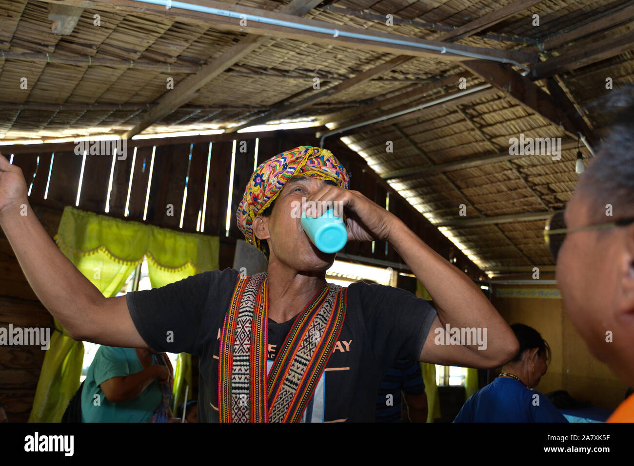 A man drinks rice wine. Rungus traditional in North Borneo Stock Photo ...