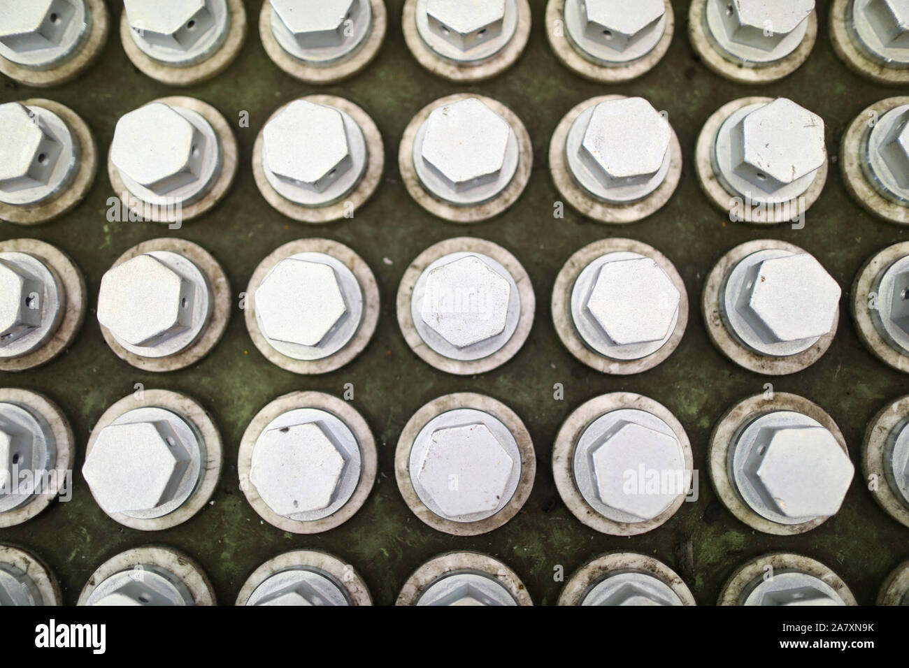 Pile of bolts in special box at industrial plant Stock Photo - Alamy