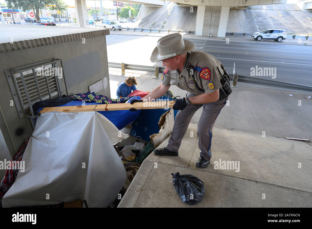 A Texas Department of Public Safety state trooper works to clear a ...