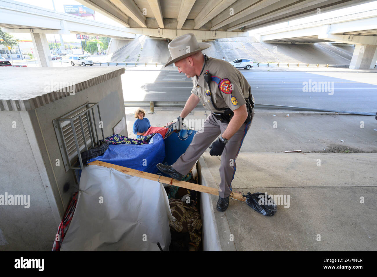A Texas Department of Public Safety state trooper works to clear a ...