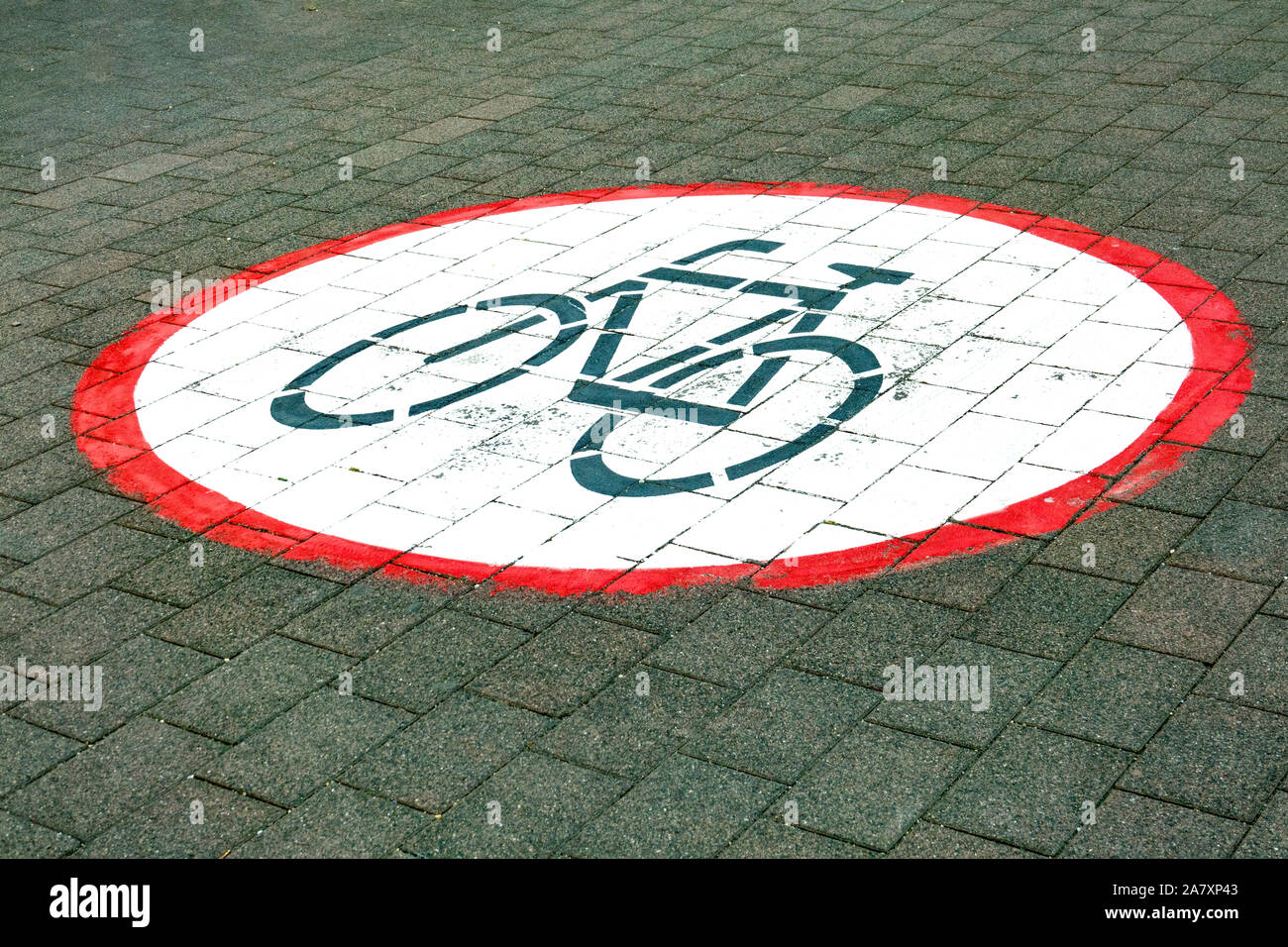 Bicycling prohibited sign on sidewalk in detail Stock Photo - Alamy