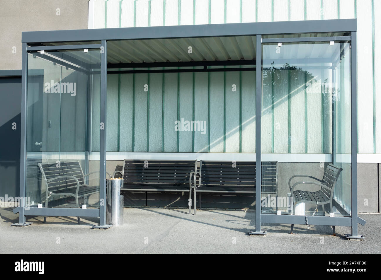 Modern outdoor relaxation area with bench outside Stock Photo - Alamy