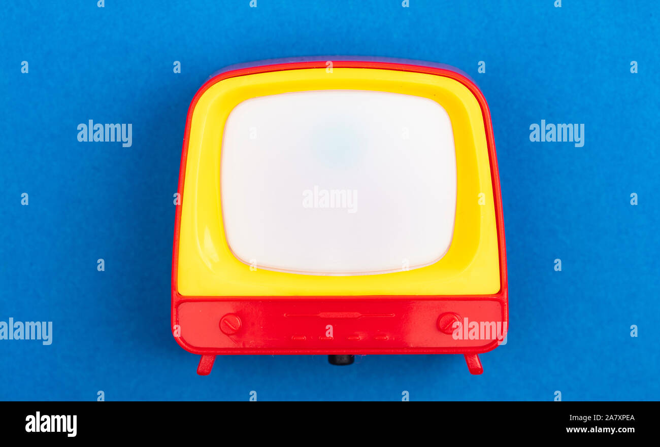Miniature Toy Television on blue background Stock Photo - Alamy