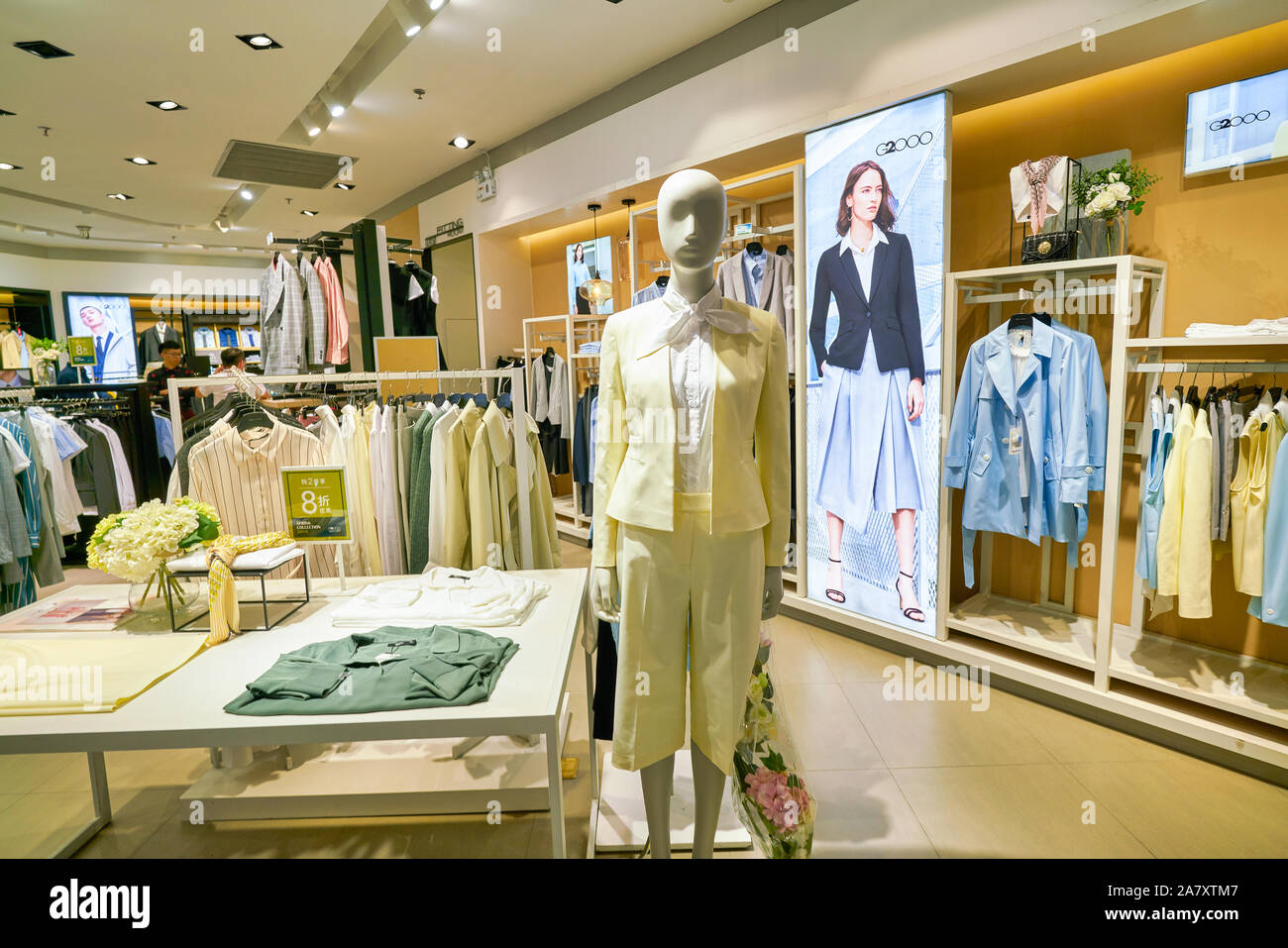 SHENZHEN, CHINA - APRIL 09, 2019: clothes on display at G2000 store in ...