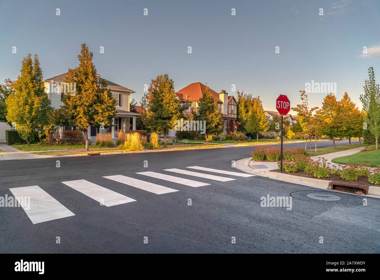 Pedestrian crossing on a street intersection day Stock Photo - Alamy