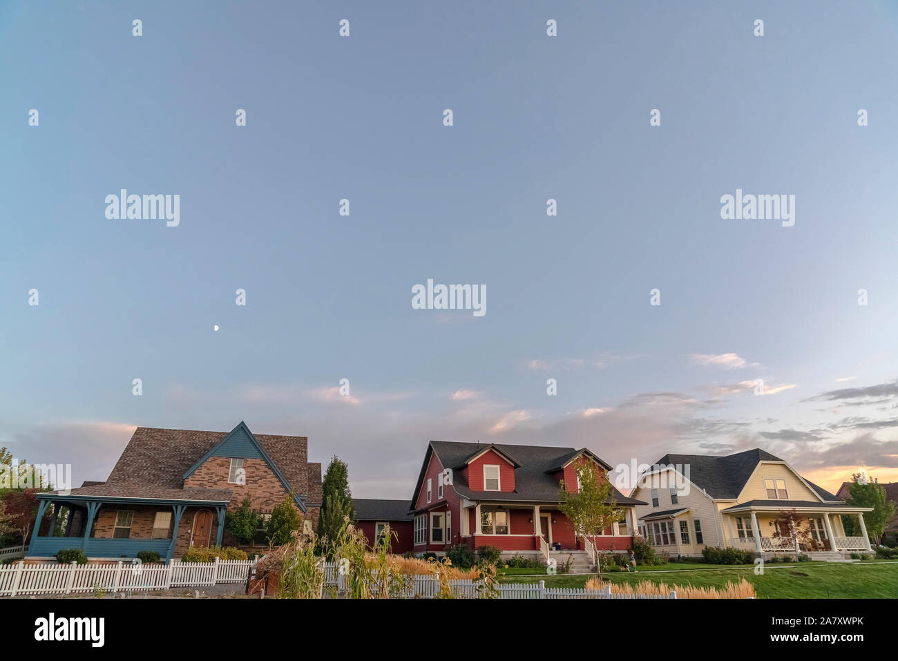 Three houses on a modern housing estate Stock Photo - Alamy