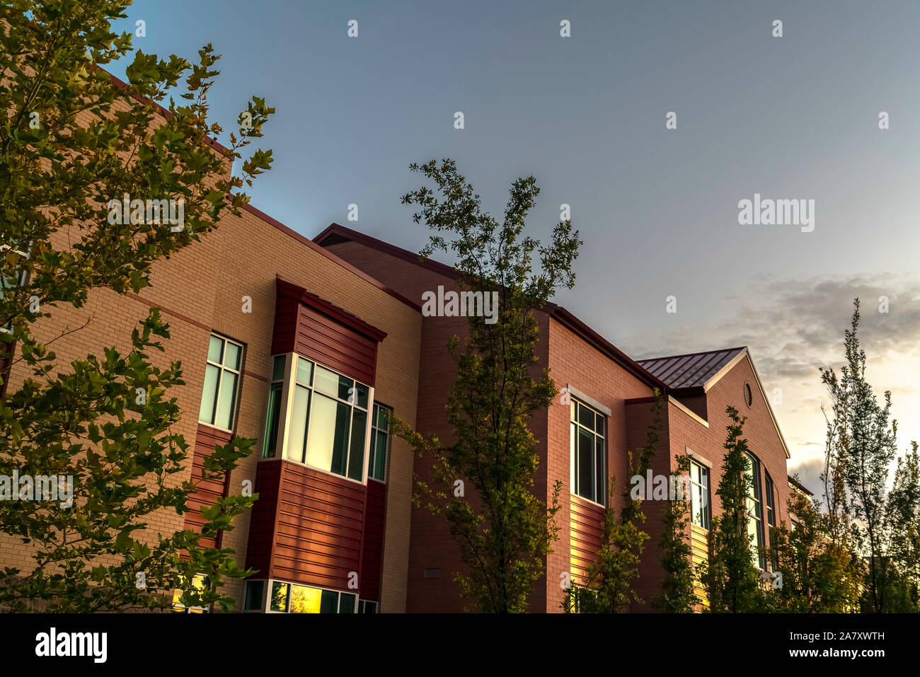 Exterior facade of a brown building development Stock Photo - Alamy