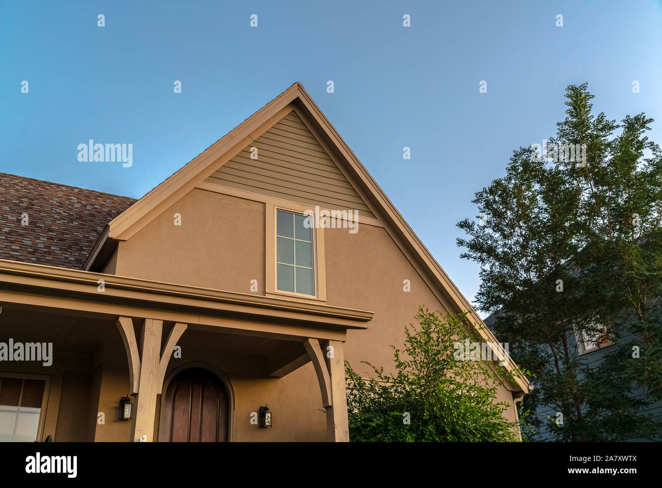 Top floor window in roof apex on a modern house Stock Photo - Alamy