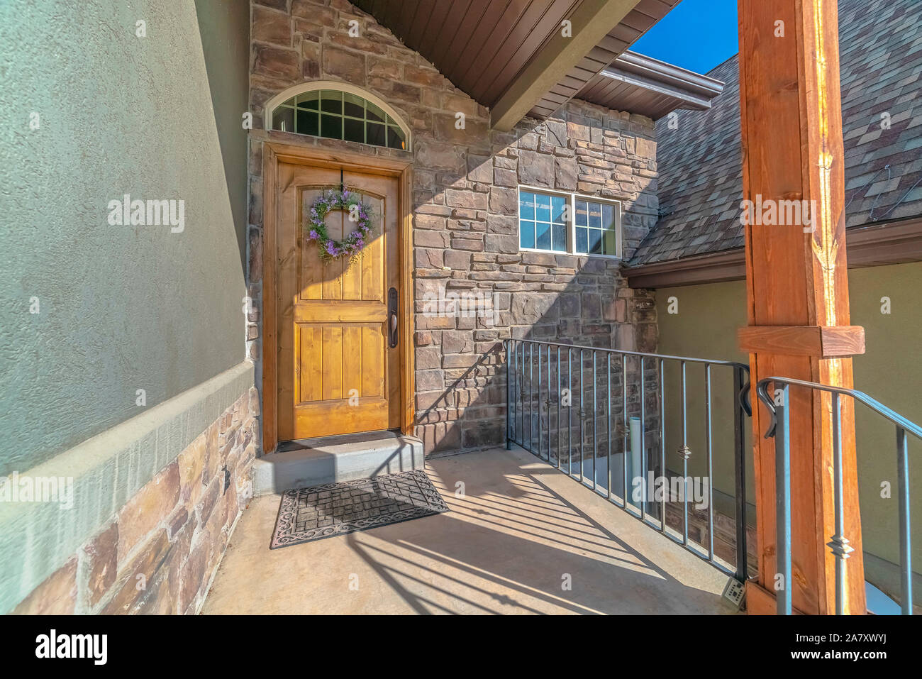 Entrance to a property with feature brick wall Stock Photo - Alamy