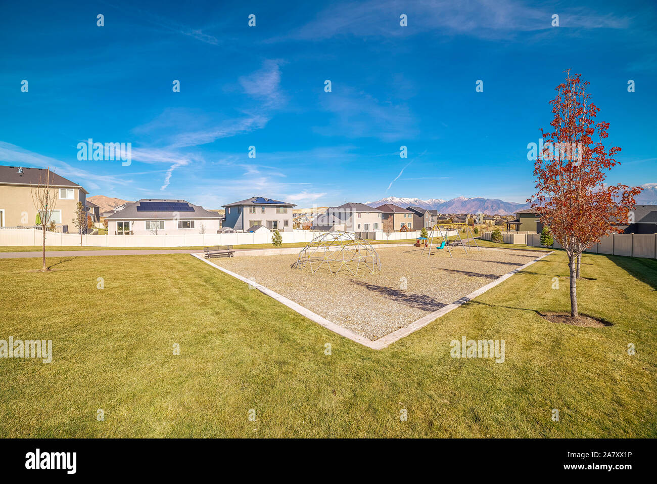 Kids playground on a housing development near sunset Stock Photo - Alamy
