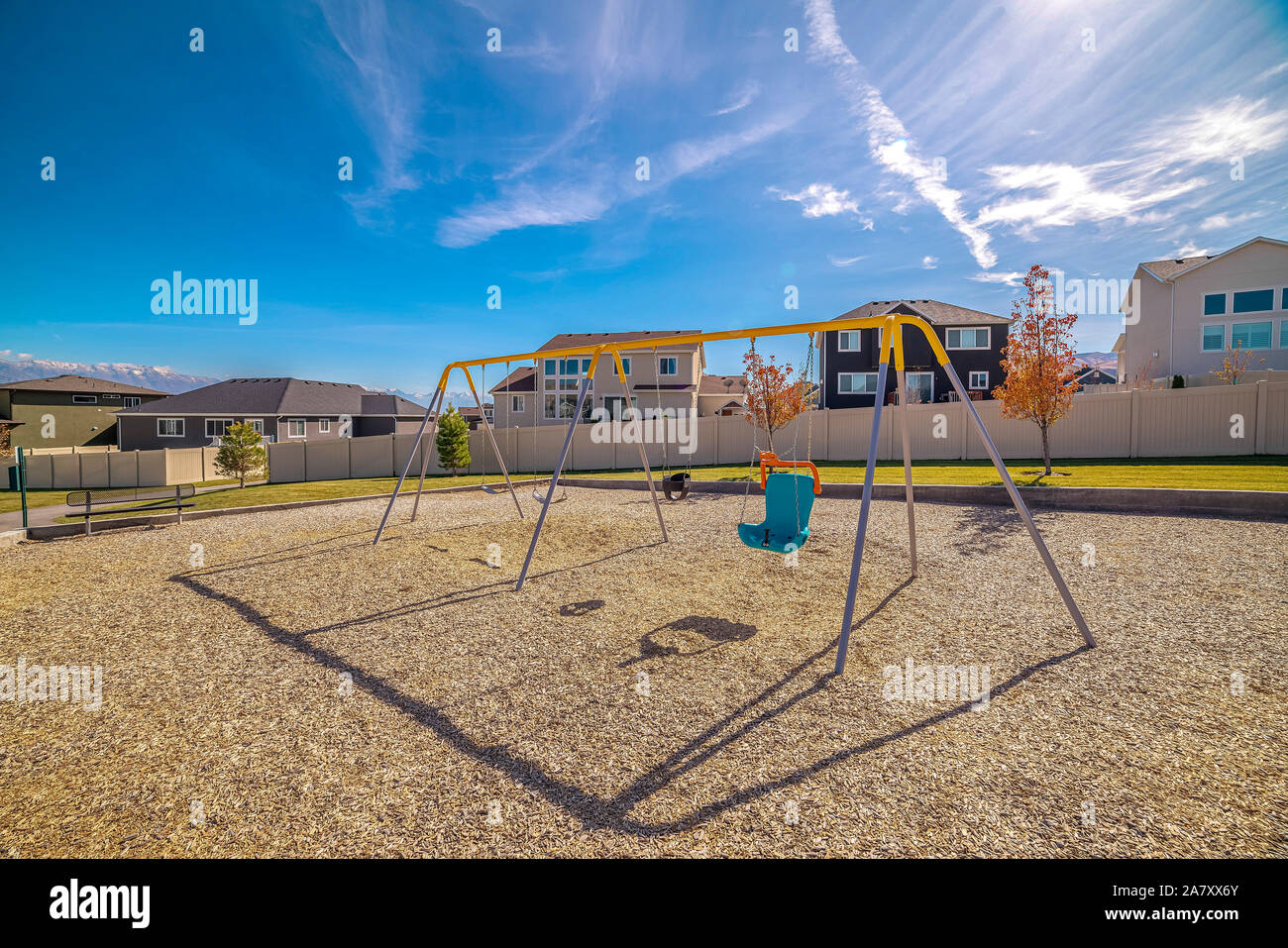 Colorful A-frame swing in a kids playground Stock Photo - Alamy