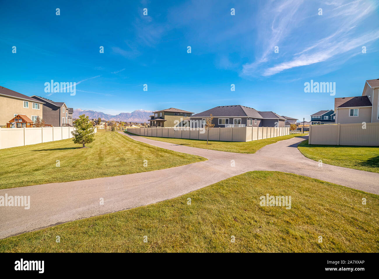 Two intersecting paved pedestrian walkways during day Stock Photo - Alamy