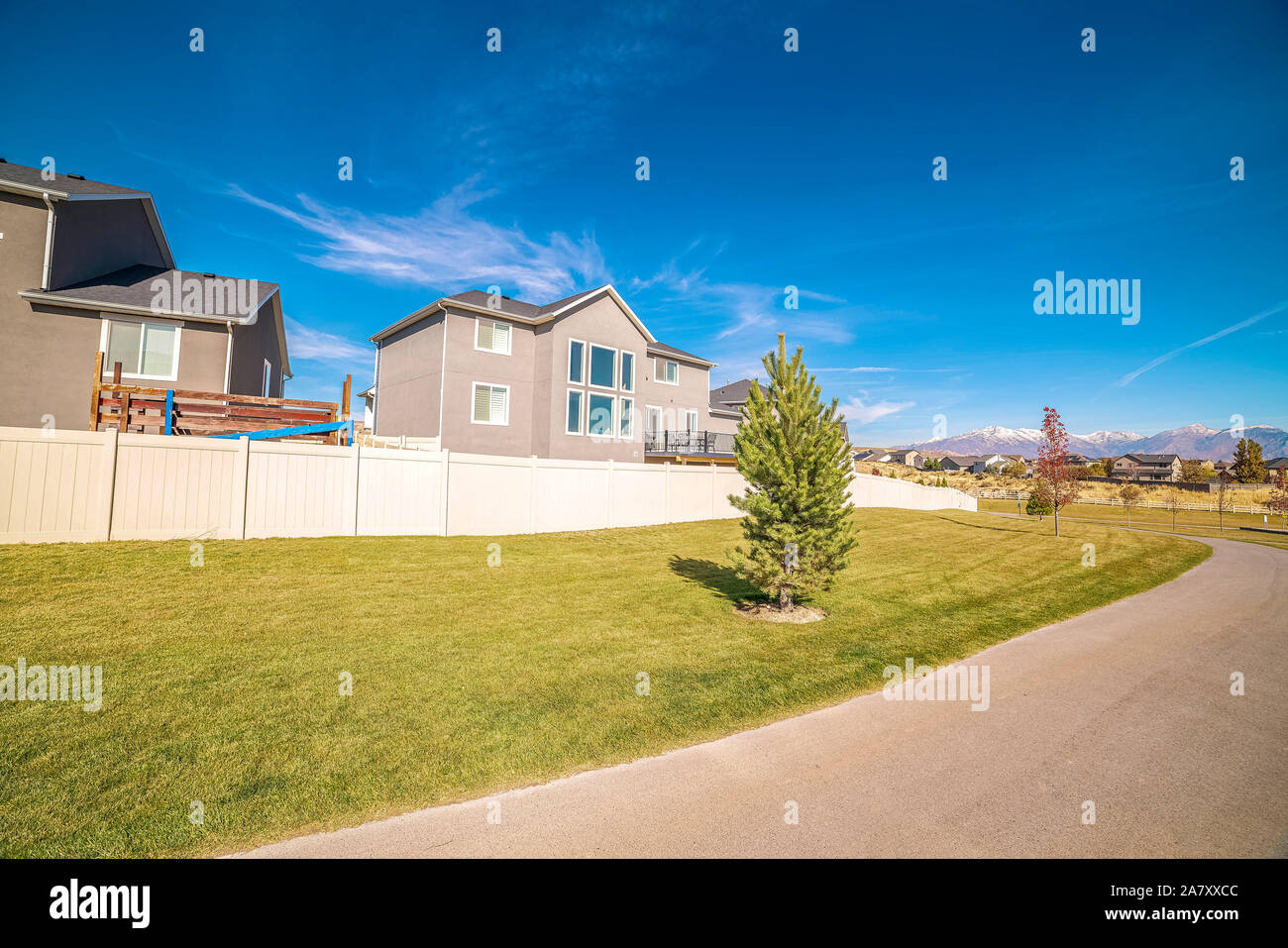 Modern housing estate with pedestrian walkway during day Stock Photo ...