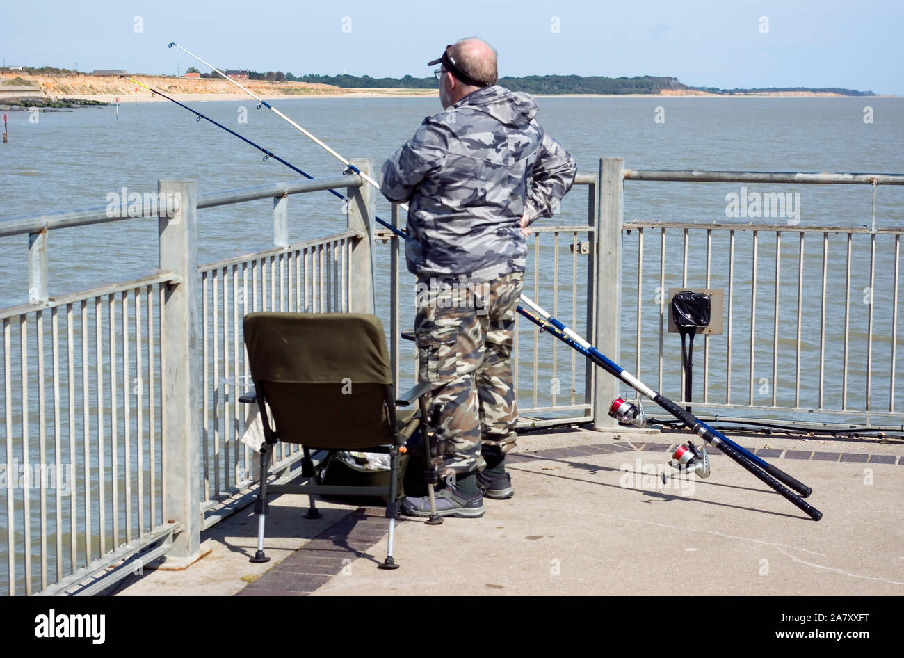 ''pier fishing'' rods hi-res stock photography and images - Alamy