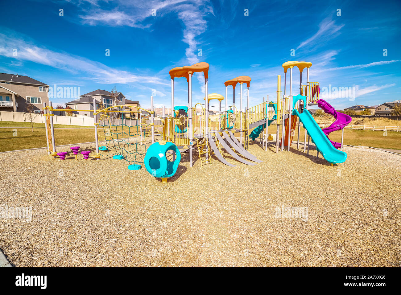 Kids playground with colorful blue slides during day Stock Photo - Alamy