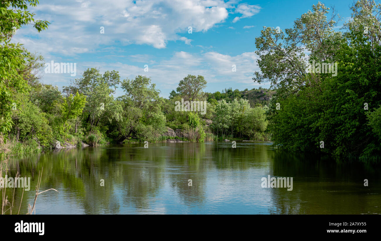 Southern Bug river in Mygiya village, Ukraine, on a sunny summer day ...