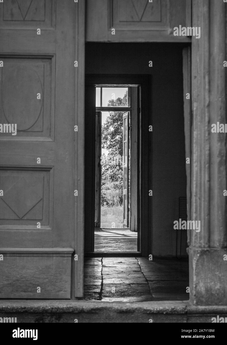 View of garden through door Black and White Stock Photos & Images - Alamy