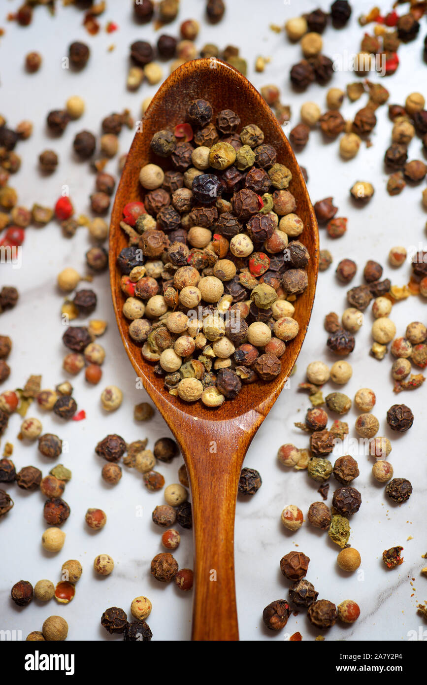 Pepper on a wood spoon Stock Photo - Alamy