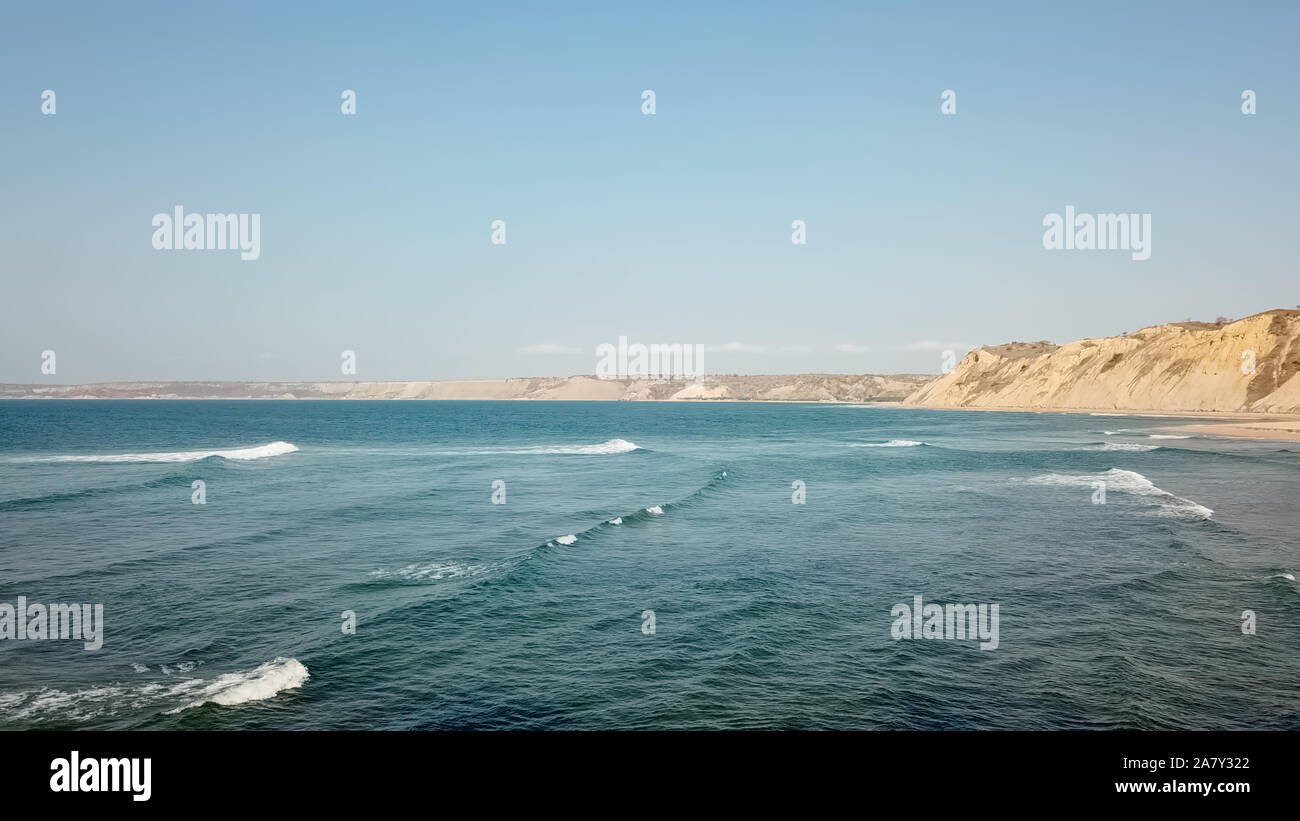 Aerial drone view of surfers beach, calm water and geology and typical ...