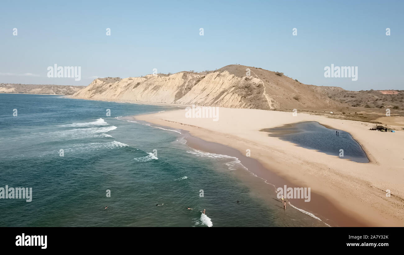 Aerial drone view of surfers beach, calm water and geology and typical ...