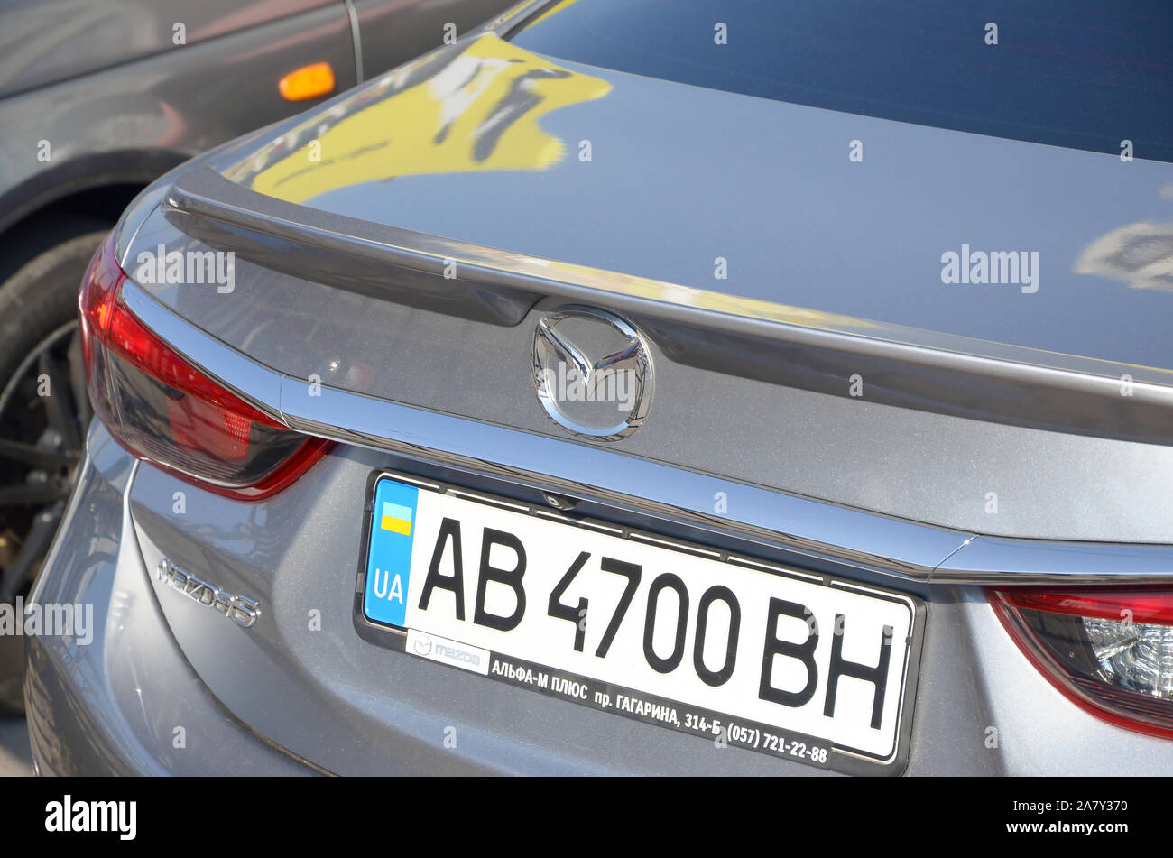 KHARKOV, UKRAINE - OCTOBER 21, 2019: The Mazda symbol on cars back part ...