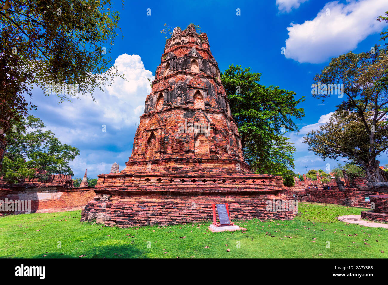 Crumbling temple structures in mid day with blue skies around the ...