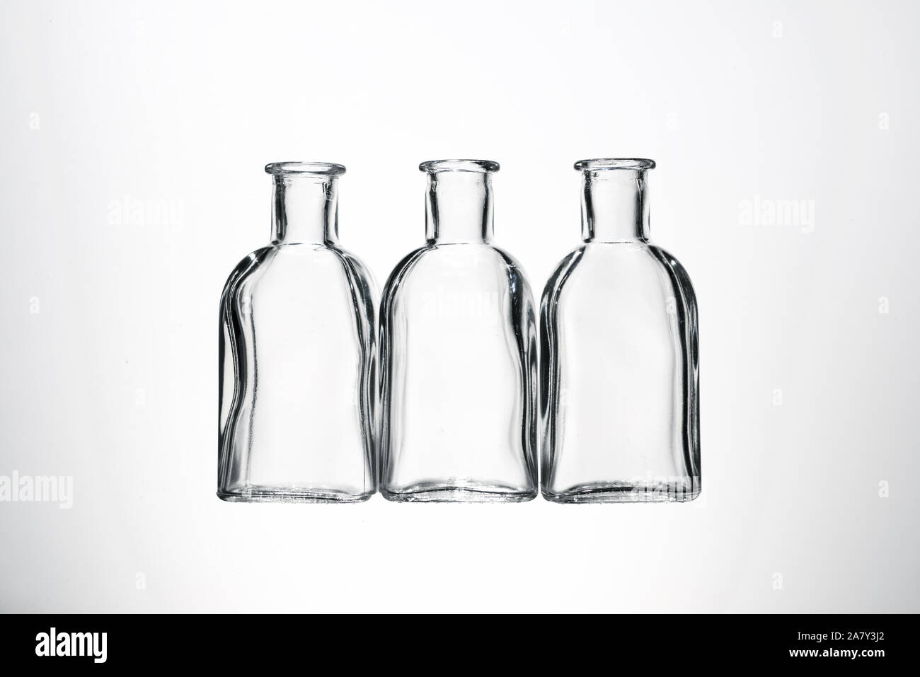 Glass bottles and white background Stock Photo - Alamy