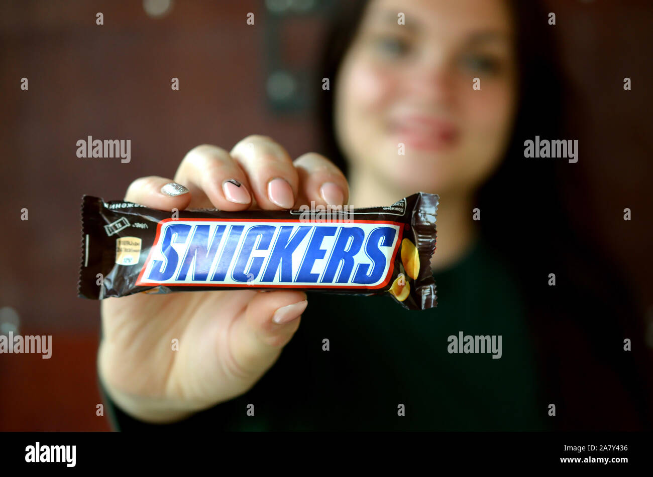 KHARKOV, UKRAINE - OCTOBER 8, 2019: A young caucasian brunette girl ...