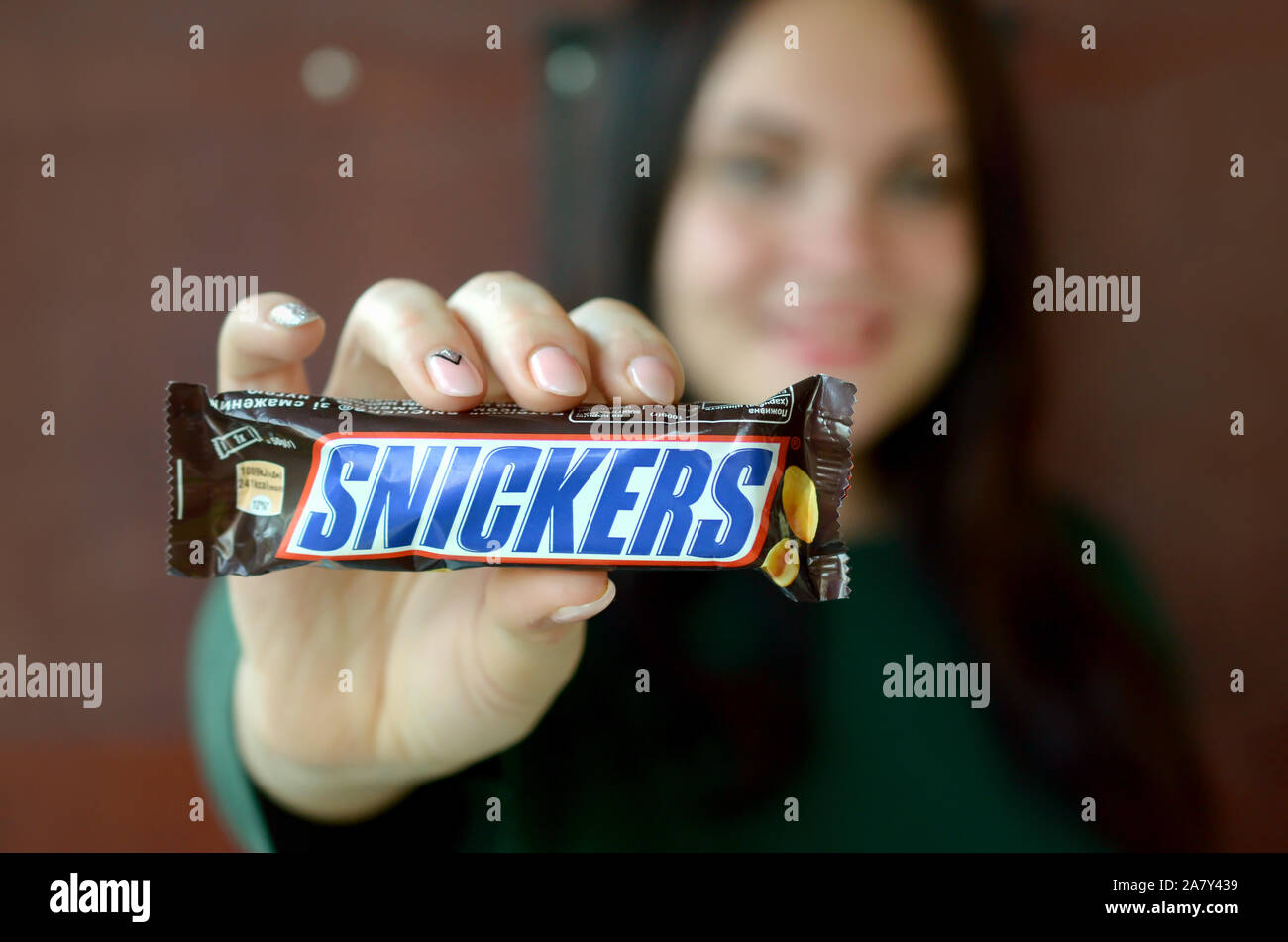 KHARKOV, UKRAINE - OCTOBER 8, 2019: A young caucasian brunette girl ...