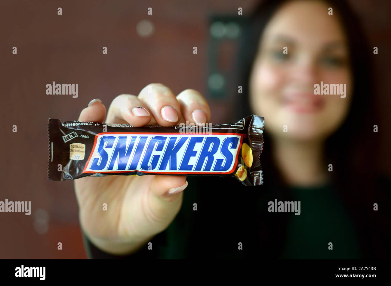 KHARKOV, UKRAINE - OCTOBER 8, 2019: A young caucasian brunette girl ...
