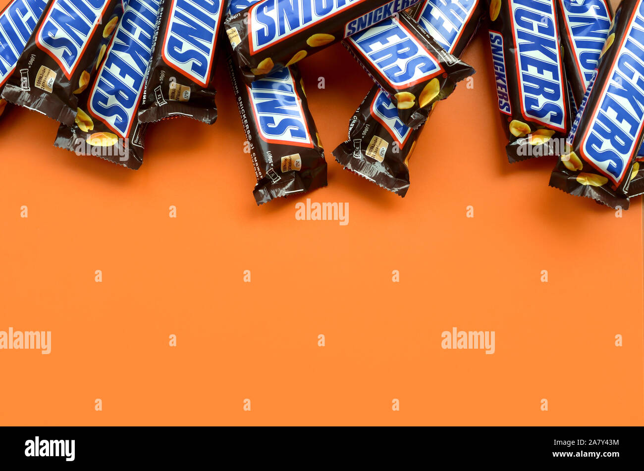 KHARKOV, UKRAINE - OCTOBER 2, 2019: Many Snickers chocolate bars lies ...