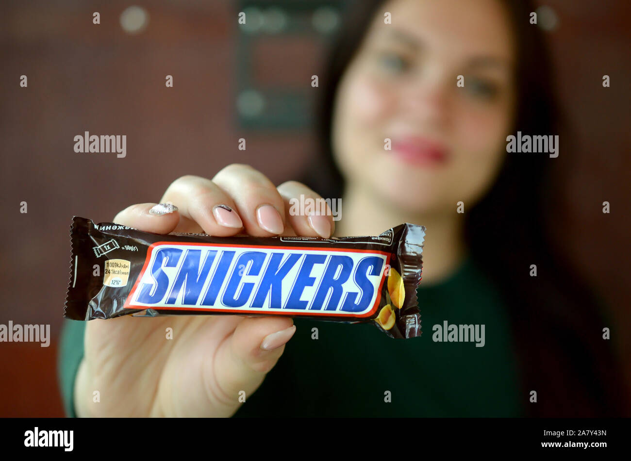 KHARKOV, UKRAINE - OCTOBER 8, 2019: A young caucasian brunette girl ...