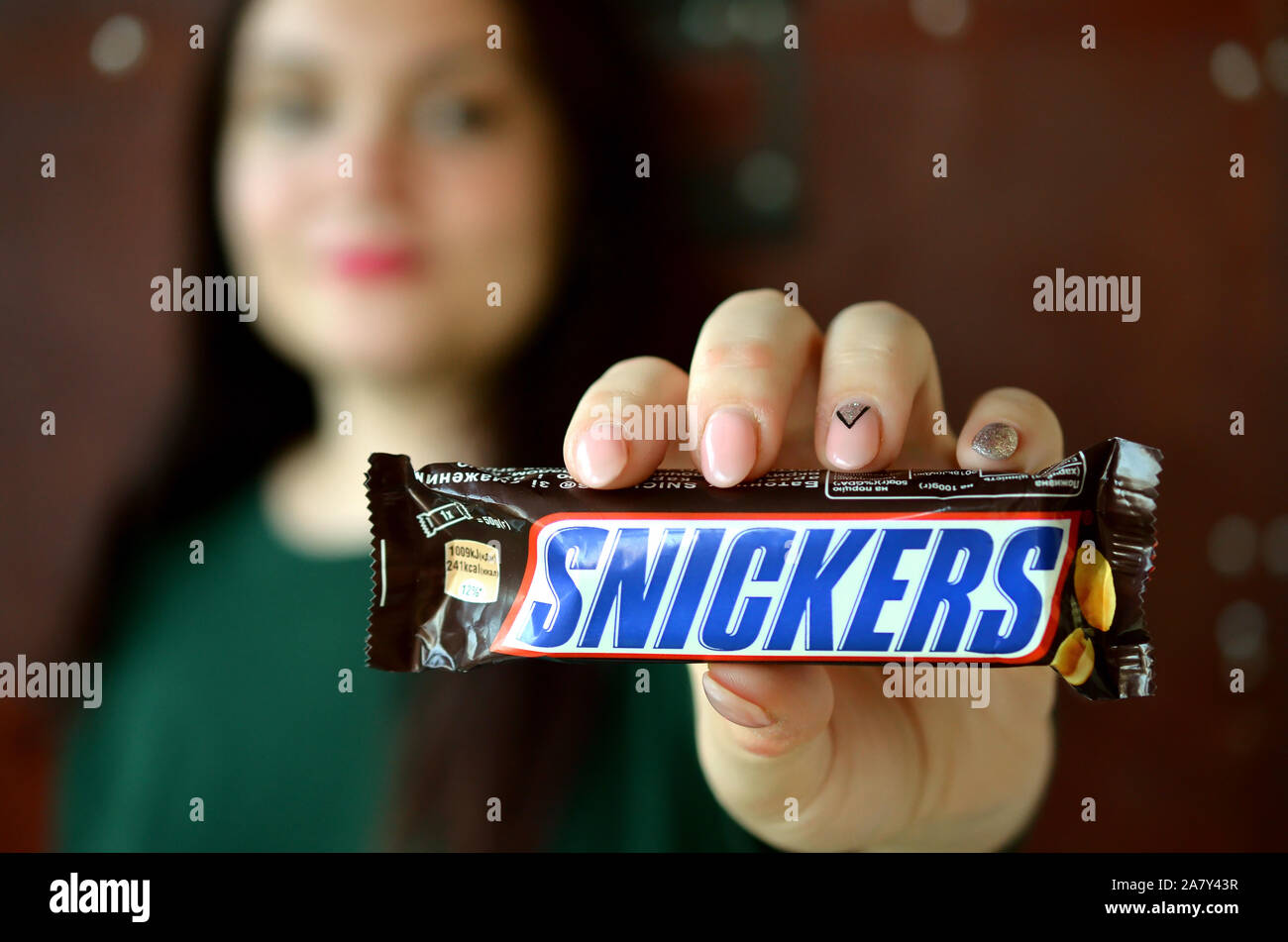 KHARKOV, UKRAINE - OCTOBER 8, 2019: A young caucasian brunette girl ...