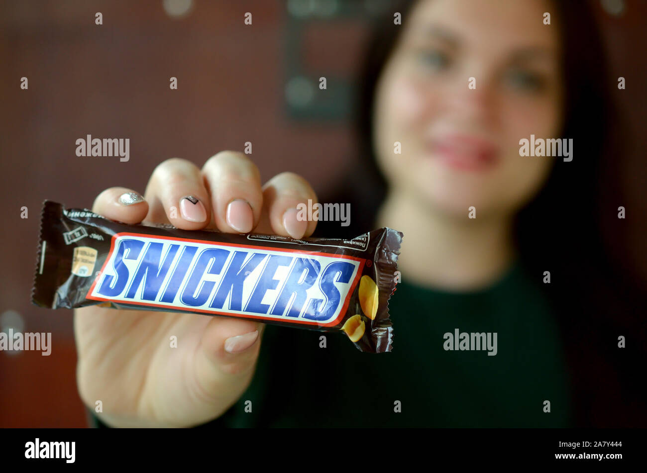 KHARKOV, UKRAINE - OCTOBER 8, 2019: A young caucasian brunette girl ...