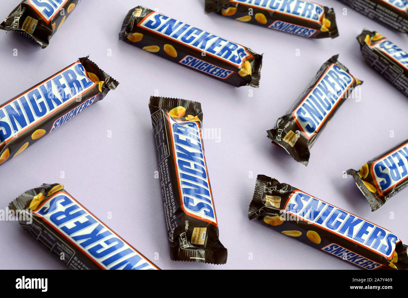 KHARKOV, UKRAINE - OCTOBER 2, 2019: Many Snickers chocolate bars lies ...