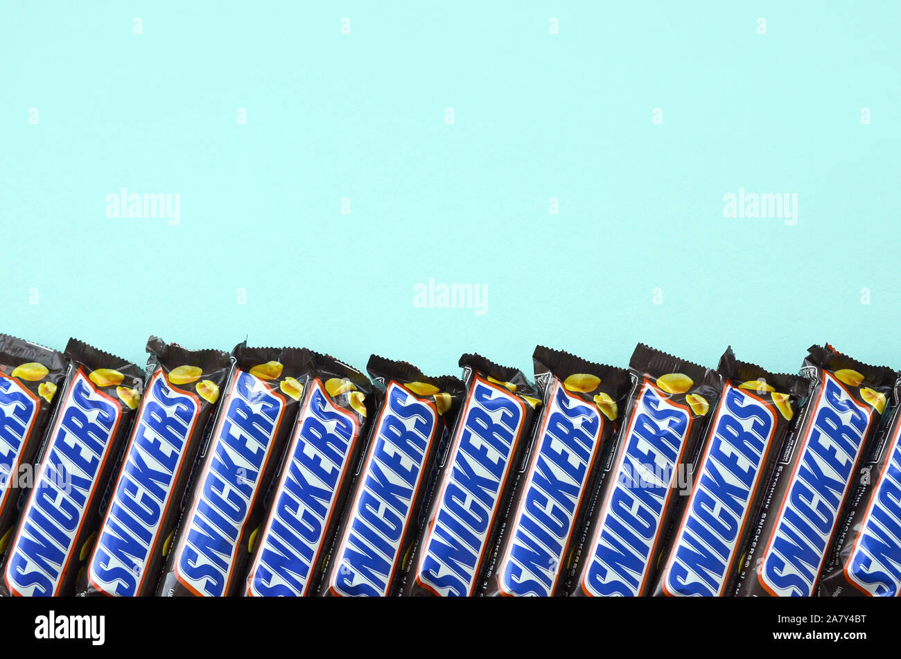 KHARKOV, UKRAINE - OCTOBER 2, 2019: Many Snickers chocolate bars lies ...