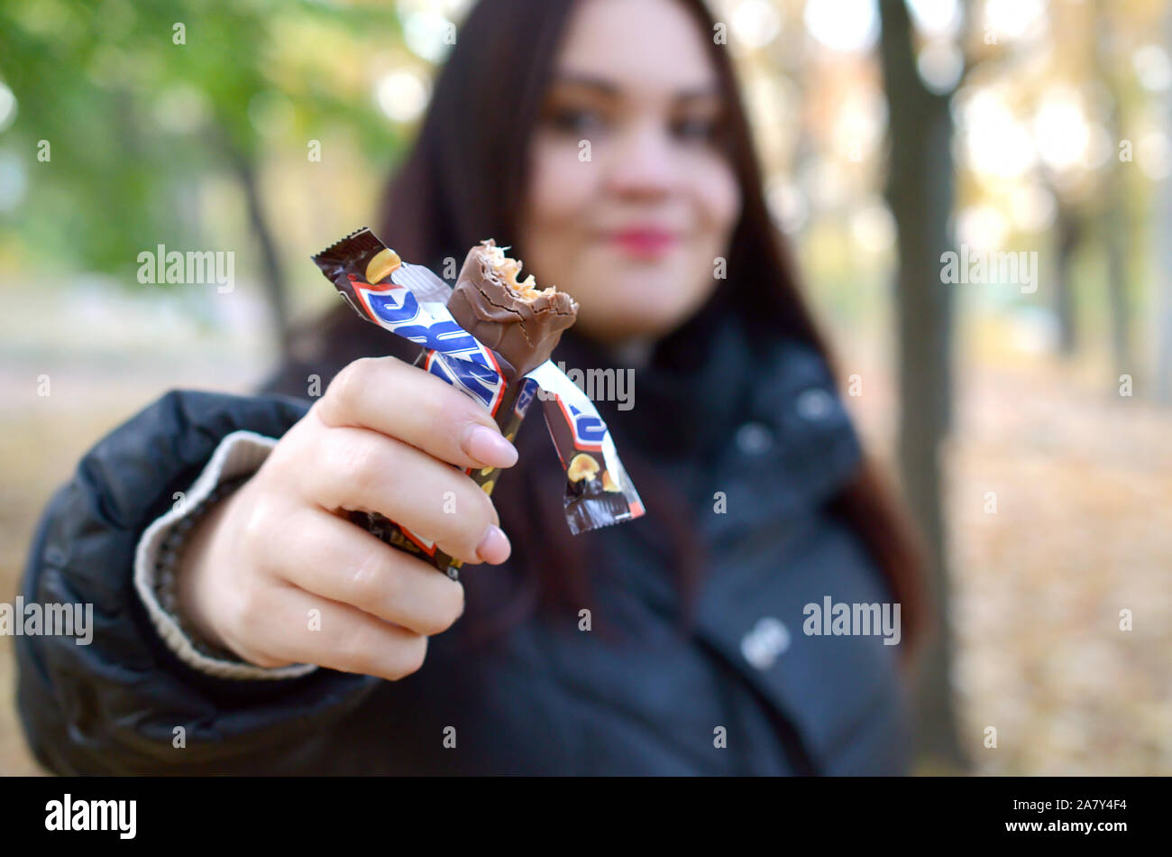 Giving a bite hi-res stock photography and images - Alamy