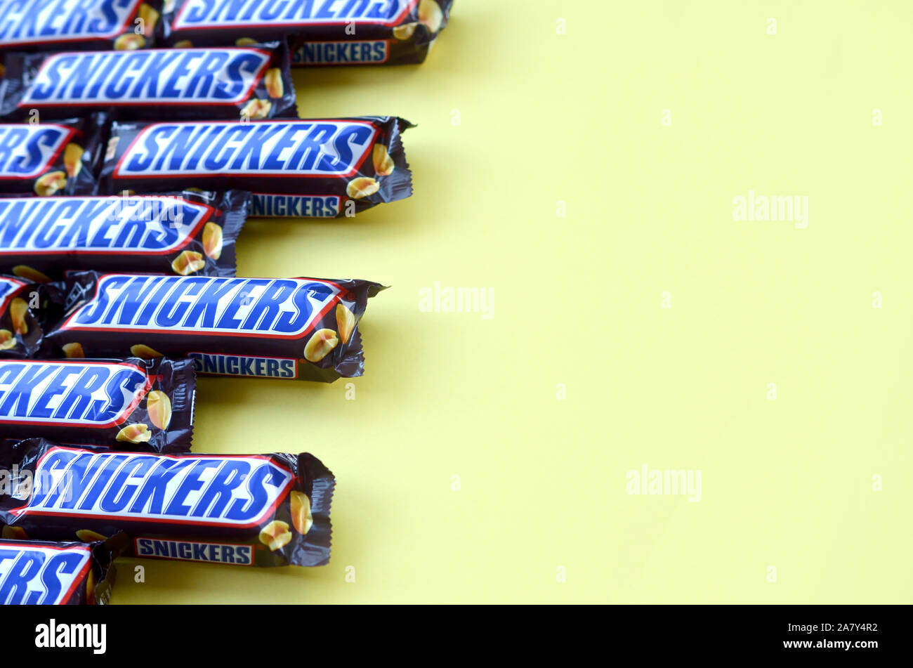 KHARKOV, UKRAINE - OCTOBER 2, 2019: Many Snickers chocolate bars lies ...