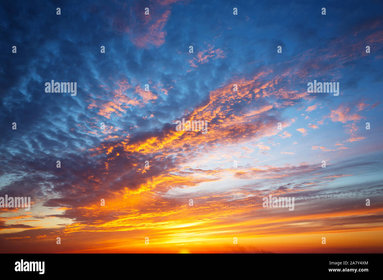 sunset sky with multicolor clouds Stock Photo - Alamy