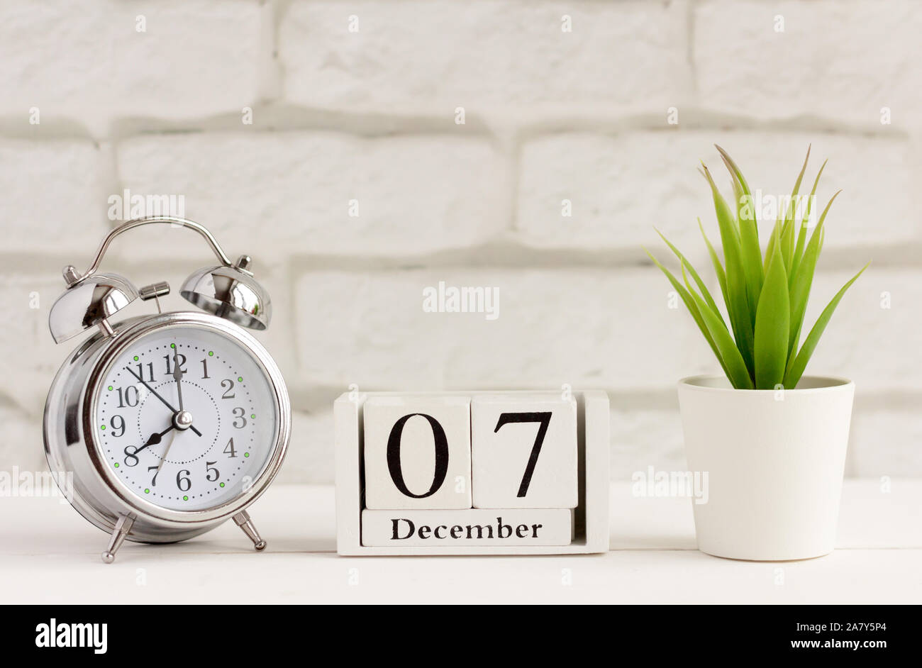 December 7, day of the month, calendar and alarm clock on a light ...