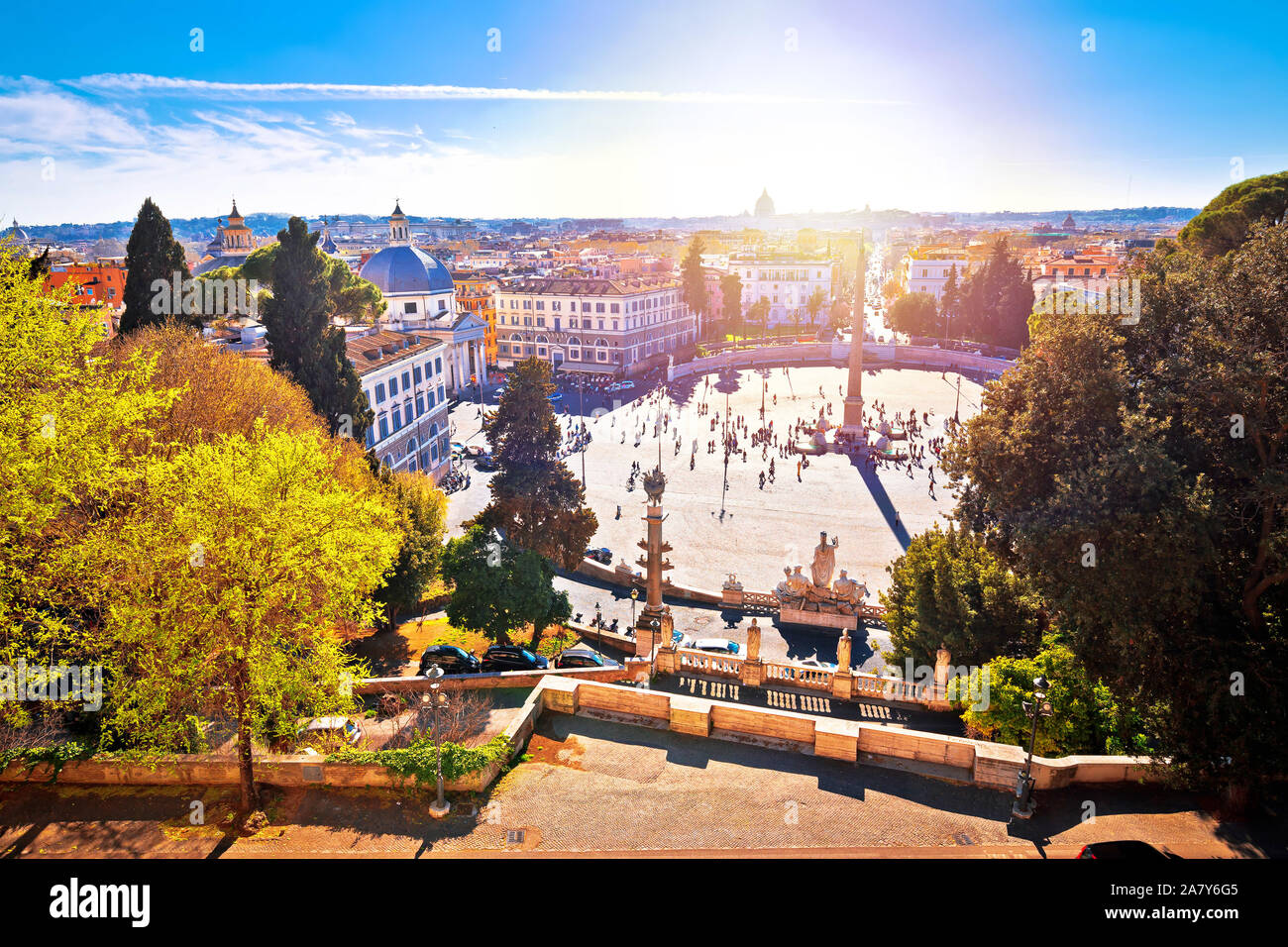 Piazza del Popolo or Peoples square in eternal city of Rome sun haze ...