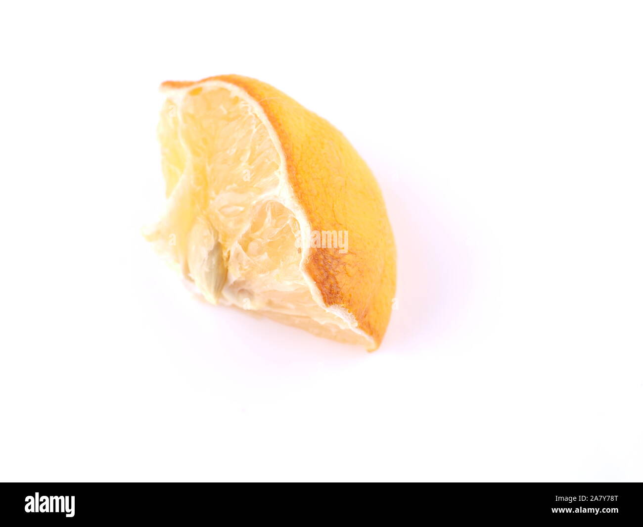 dried yellow lemon on a white background Stock Photo - Alamy