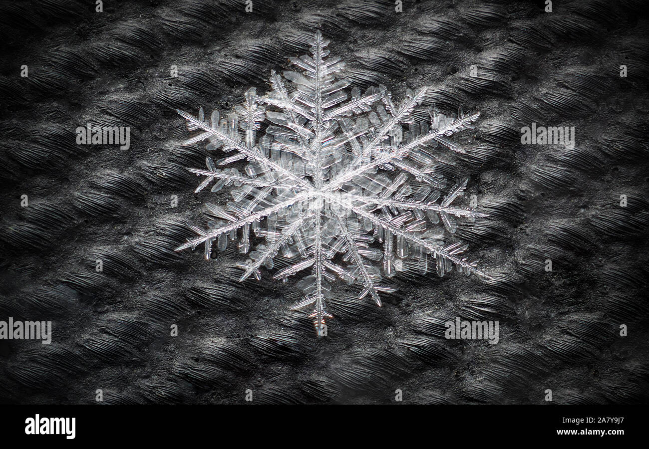 snowflake on a dark background Stock Photo - Alamy