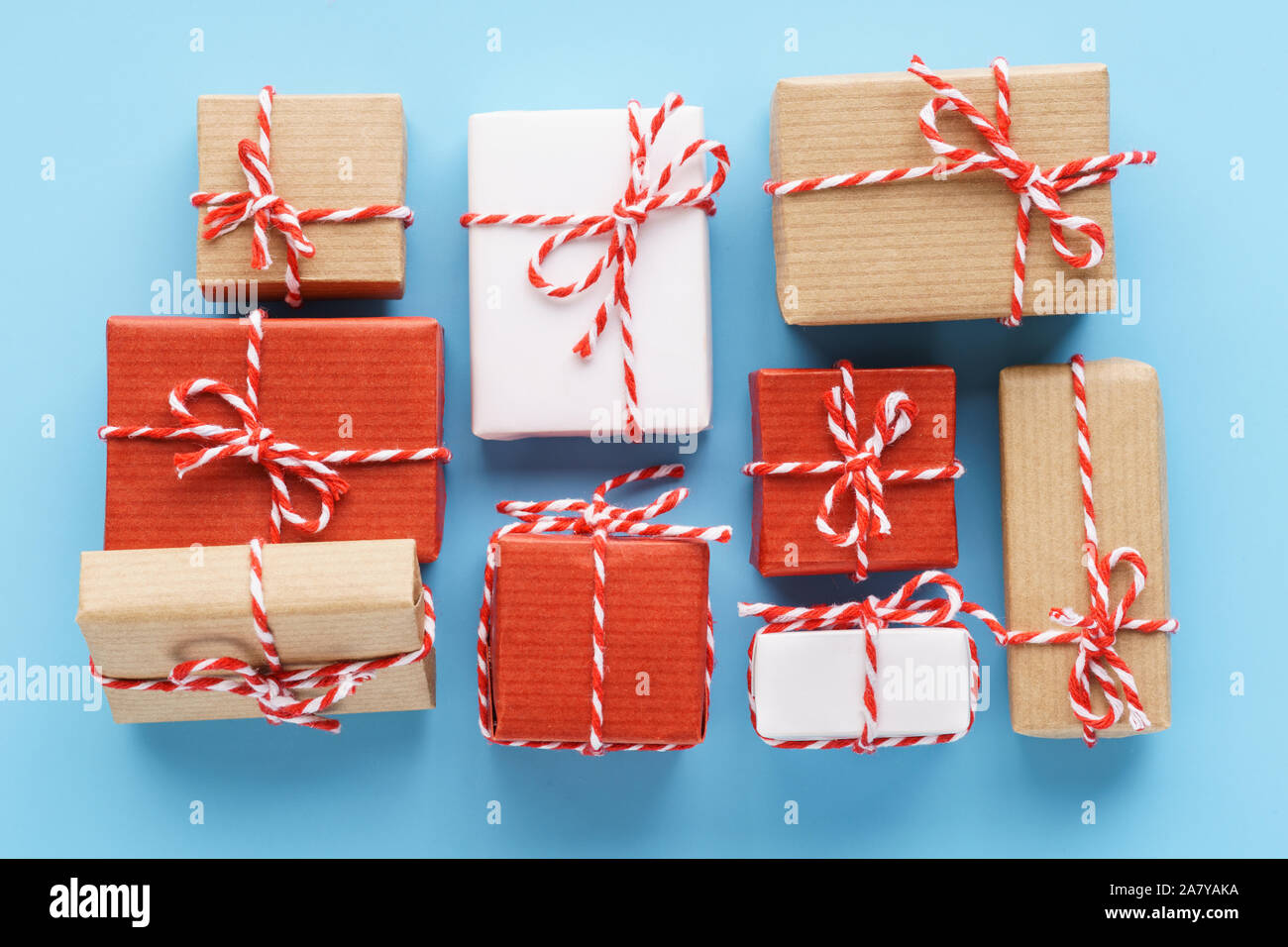 Collection of handcrafted gift boxes on light blue background. Flat lay ...
