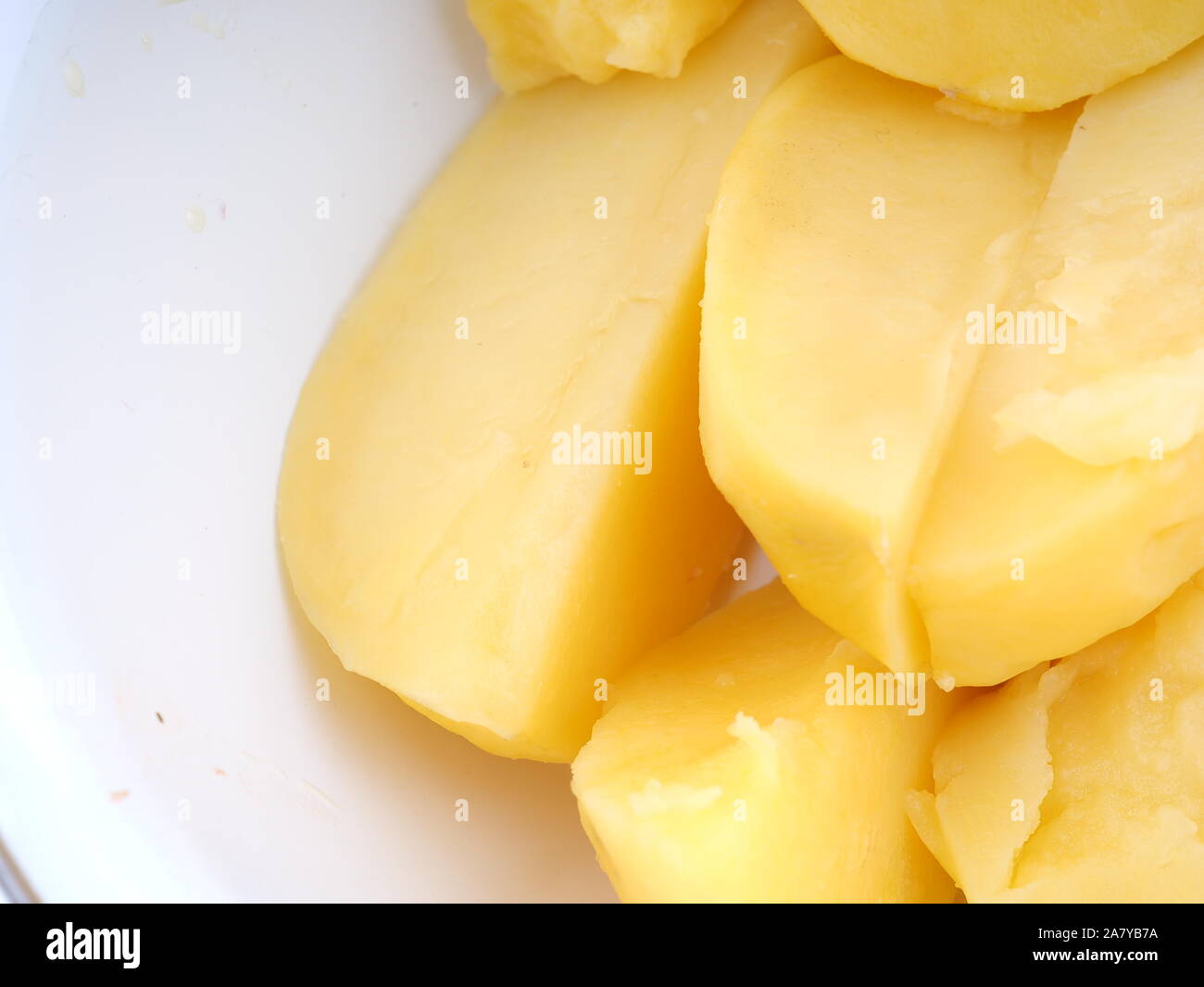 boiled potatoes on white background Stock Photo - Alamy